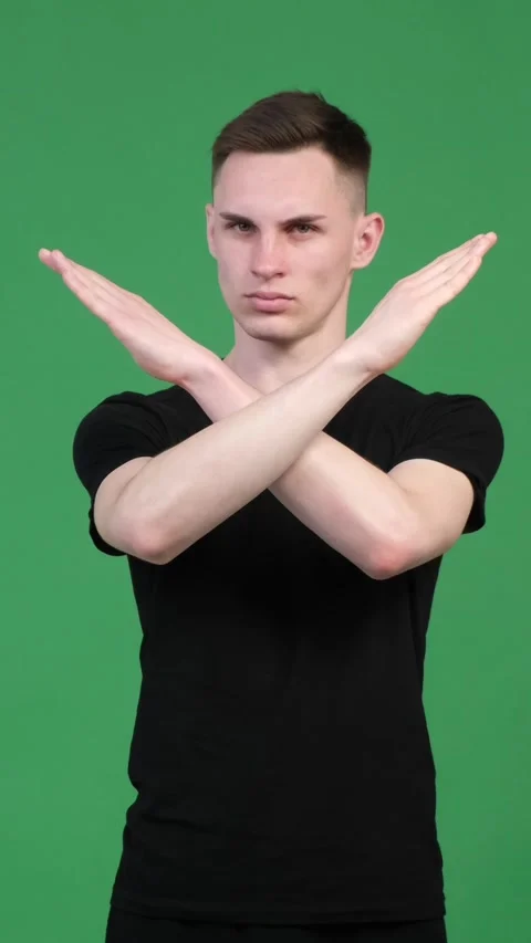 Stern Man Showing Stop Sign With Crossed... | Stock Video | Pond5