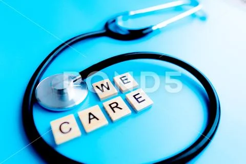 Stethoscope and We Care sign family concept on blue background, Health ...