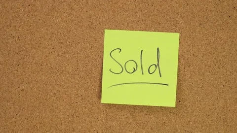 Stick the sticker sold on the cork board... | Stock Video | Pond5