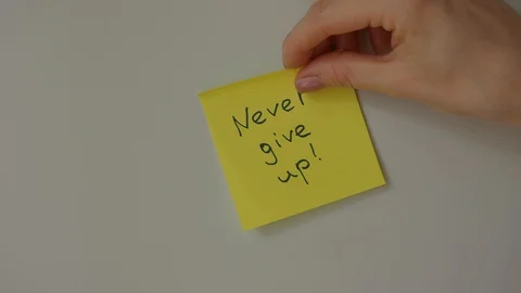 Sticky note Never give up being sticked ... | Stock Video | Pond5
