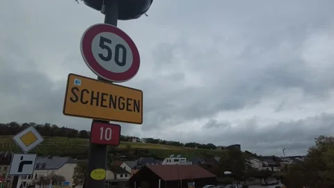 Still shot of a road sign of Schengen, L... | Stock Video | Pond5
