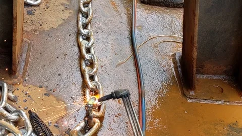 still working on a ship's iron chain ble... | Stock Video | Pond5