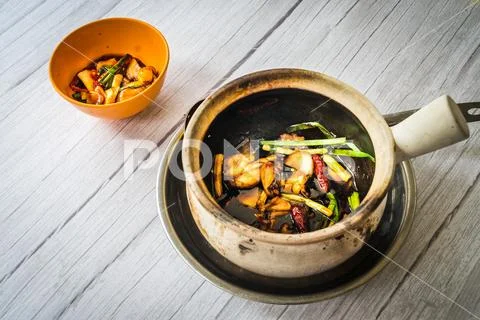 Stir fry frog leg with spring onions and dried reed chilli and served ...