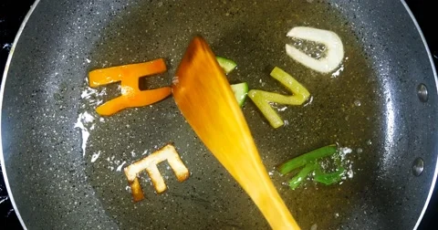 Stir-frying mixed alphabet letters, word... | Stock Video | Pond5