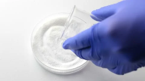 stirring white medical powder in laborat... | Stock Video | Pond5