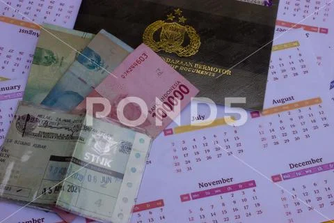 STNK with the concept of paying vehicle tax with a calendar background ...