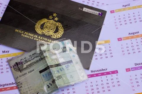 STNK with the concept of paying vehicle tax with a calendar background ...