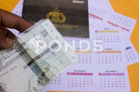 STNK with the concept of paying vehicle tax with a calendar background ...