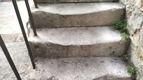 Stone steps worn down from foot traffic.... | Stock Video | Pond5