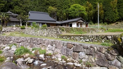 Stone walls and flowing stream by tradit... | Stock Video | Pond5