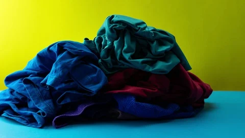 Stop motion animation of pile clothes on... | Stock Video | Pond5