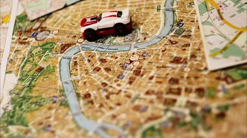 Stop motion toy car driving on city map. | Stock Video | Pond5