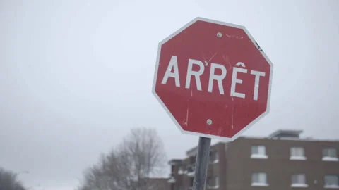 stop sign in canada reading arret in win... | Stock Video | Pond5