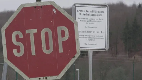 Stop Sign with Military Sign in Backgrou... | Stock Video | Pond5