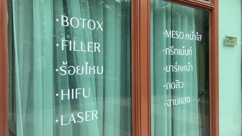 Storefront sign window glass - botox, fi... | Stock Video | Pond5