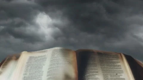 Storm clouds over open Bible looping bac... | Stock Video | Pond5