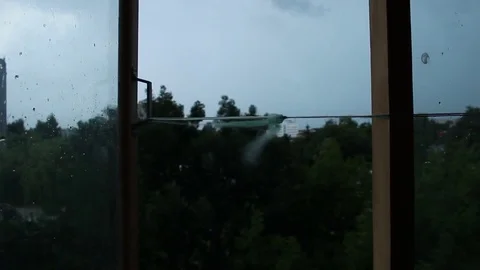 Stormy weather seen through open window,... | Stock Video | Pond5