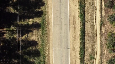 Straight asphalt road with cars in green... | Stock Video | Pond5