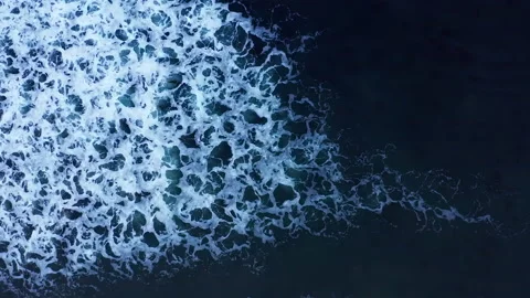 Straight down aerial view of a wave brea... | Stock Video | Pond5