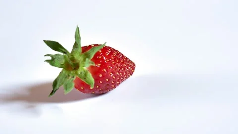 The strawberry berry is spinning. Side v... | Stock Video | Pond5