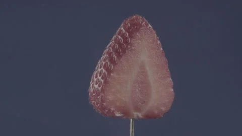 Strawberry rotating with loop on blue sc... | Stock Video | Pond5