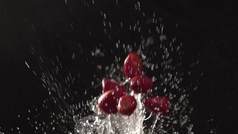Strawberry throw up with water splash dr... | Stock Video | Pond5
