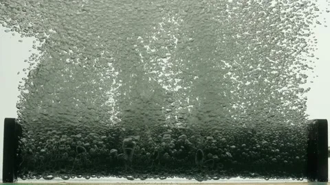 Stream of air bubbles escaping from dark... | Stock Video | Pond5