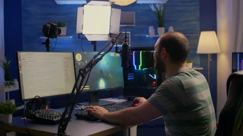 Streamer man sitting on gaming chair | Stock Video | Pond5