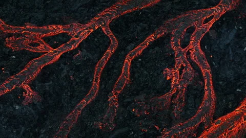 Streams of red hot lava flowing during a... | Stock Video | Pond5