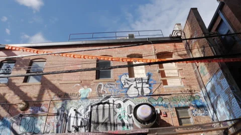 Street art graffiti on the side of a bui... | Stock Video | Pond5