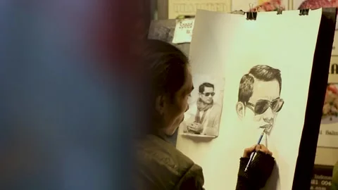 a street artist drawing a sketch | Stock Video | Pond5