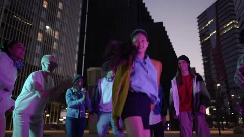 Street city night life. Party group of y... | Stock Video | Pond5