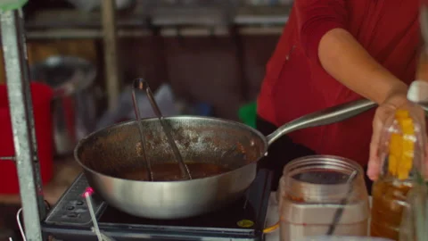 Street Food Vendor Cooking Stew in Wok o... | Stock Video | Pond5