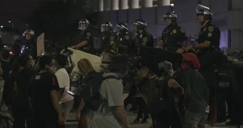 Street Showdown: Angry Protesters Face W... | Stock Video | Pond5