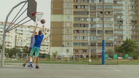 Streetball player scoring field goal on ... | Stock Video | Pond5