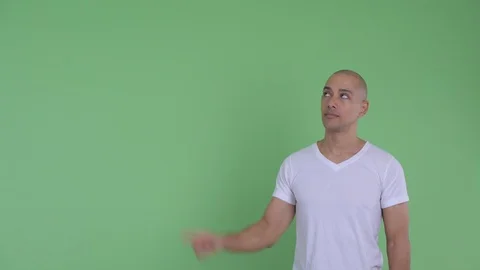 Stressed bald man pointing up and giving... | Stock Video | Pond5