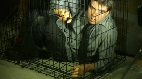 stressed business man in cage | Stock Video | Pond5