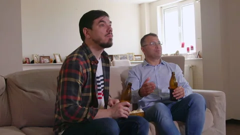 Stressed football fans supporting their ... | Stock Video | Pond5