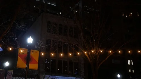 String lights in shopping plaza with bac... | Stock Video | Pond5