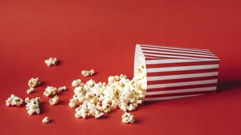 Striped box with popcorn for movie night | Stock Video | Pond5