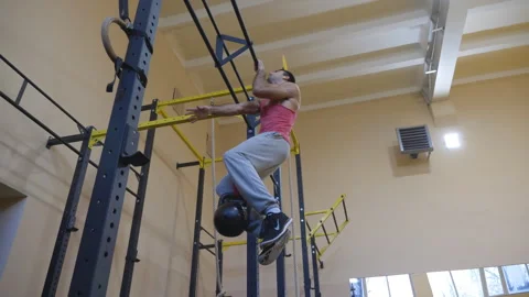 Strong athlete doing one hand pull ups w... | Stock Video | Pond5
