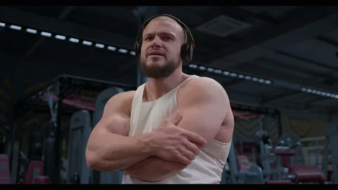 Strong muscular man resting between sets... | Stock Video | Pond5