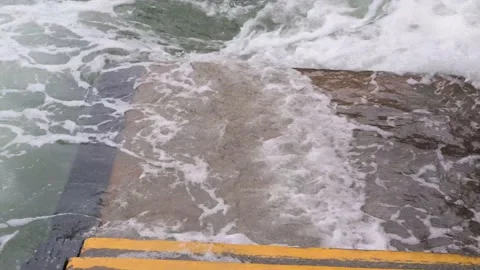 Strong sea currents splash water at the ... | Stock Video | Pond5