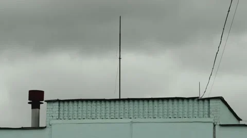 A strong wind shakes the wires on the ro... | Stock Video | Pond5