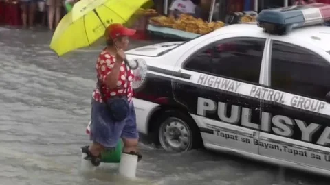 Strong winds, flooding hit Philippines a... | Stock Video | Pond5
