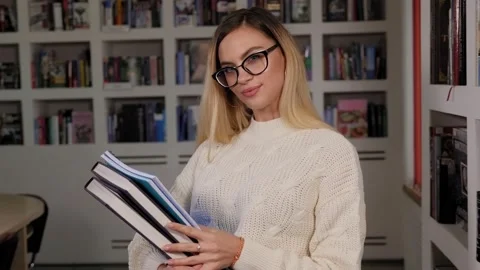 A student girl with glasses is standing ... | Stock Video | Pond5