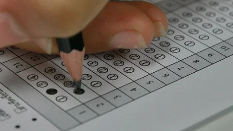 Student hand filling out in answer sheet... | Stock Video | Pond5