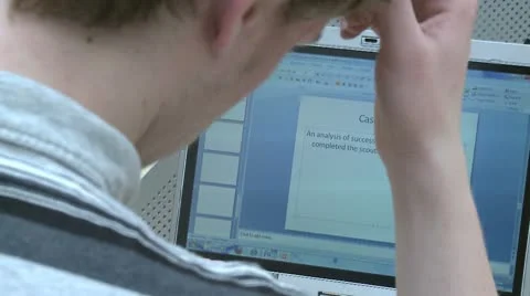 Student looking at computer in classroom... | Stock Video | Pond5