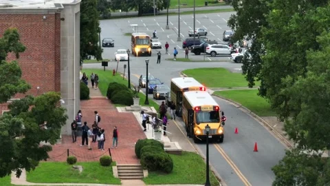 Students arrive at school building. Bus ... | Stock Video | Pond5