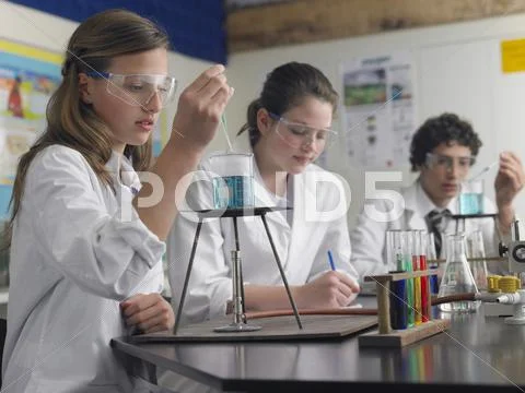 Students Caring Out Experiments In Laboratory ~ Premium Photo #31874919